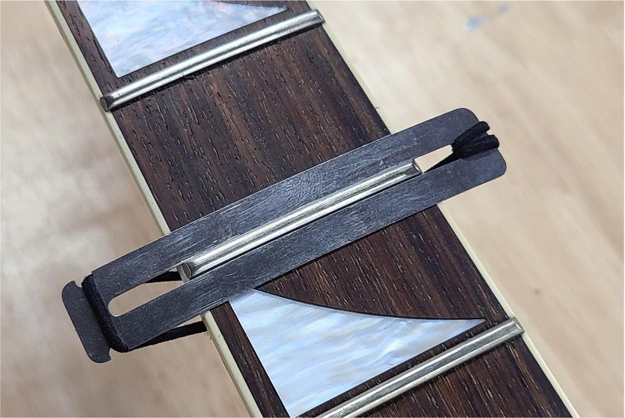 Fretboard Guard with rubber band and Fret Polishing Wool